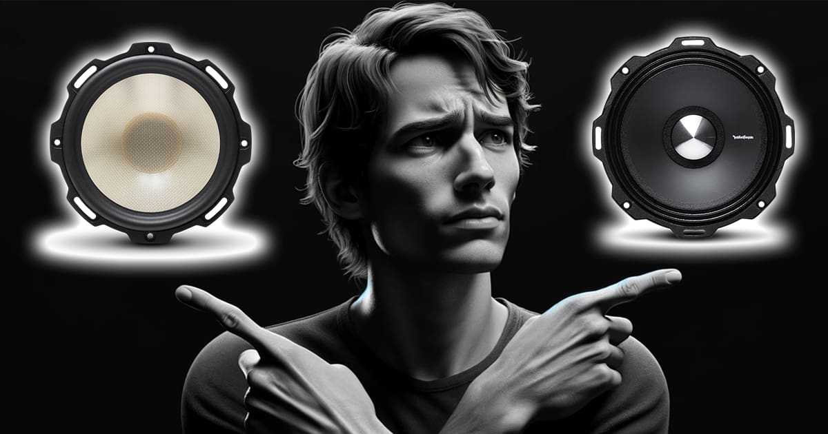 A confused looking man with his arms crossed, pointing at a speaker on ...